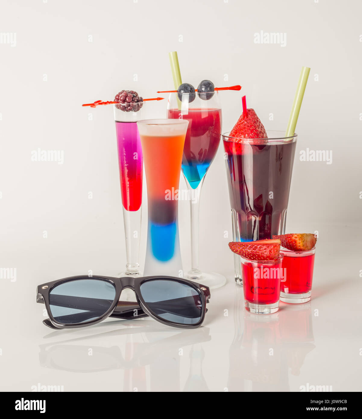 Colorful set of drinks, color drink decorated with fruit, sunglasses ...