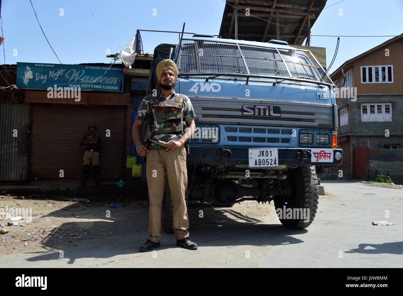 Srinagar, India. 16th Apr, 2017. Indian paramilitary soldiers stands ...