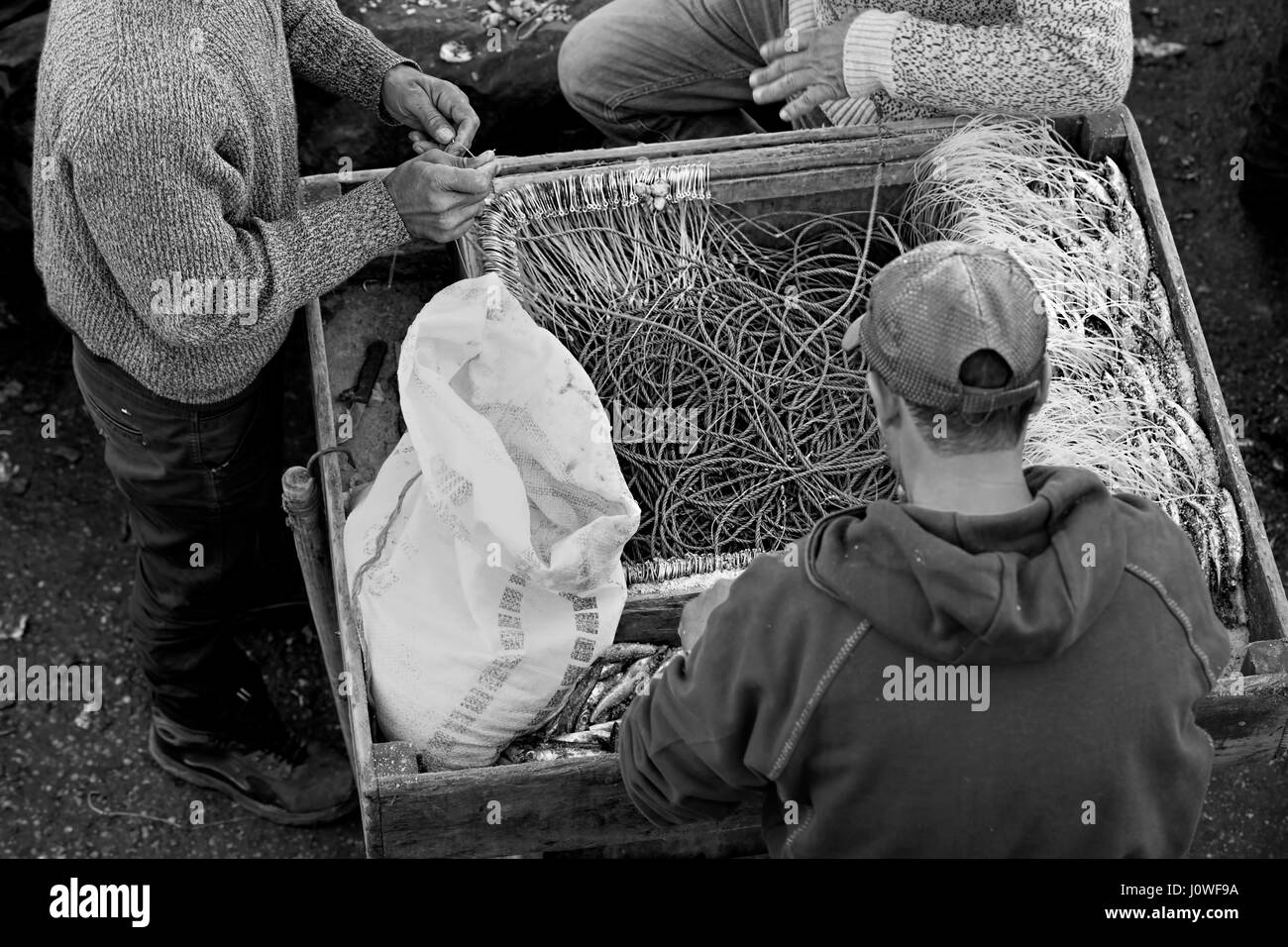 Fishermen hand Black and White Stock Photos & Images - Alamy