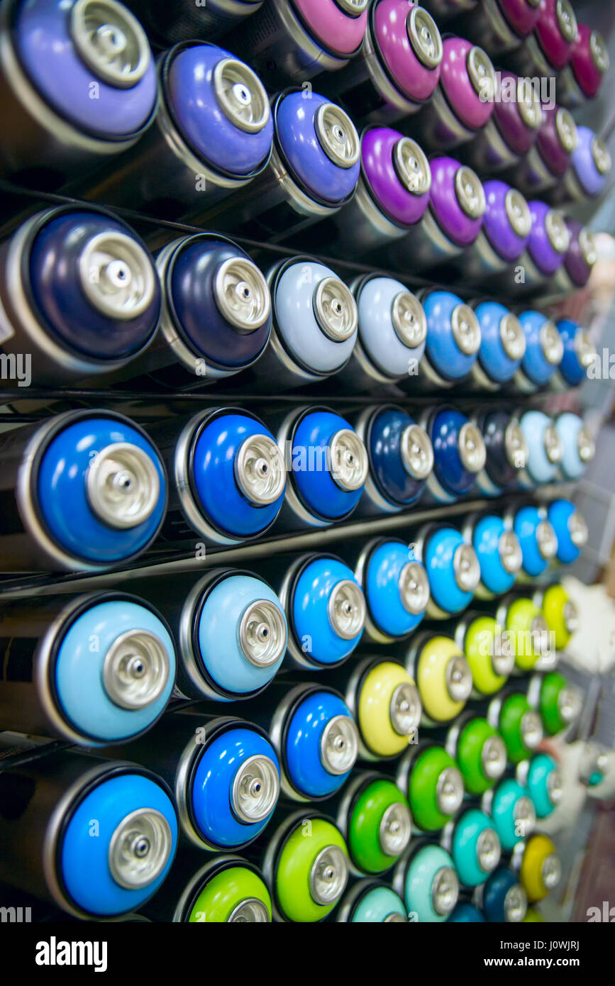 colorful cans of paint stand rows on a shelf Stock Photo - Alamy