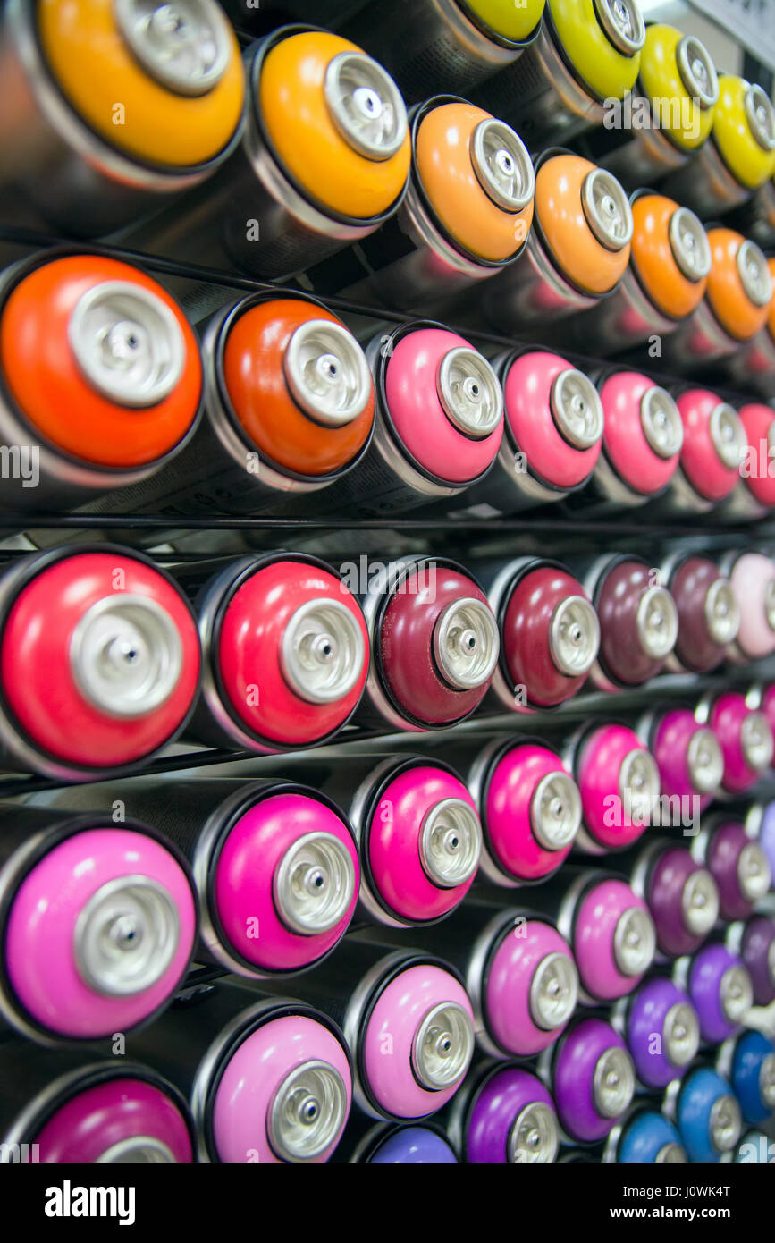 colorful cans of paint stand rows on a shelf Stock Photo - Alamy