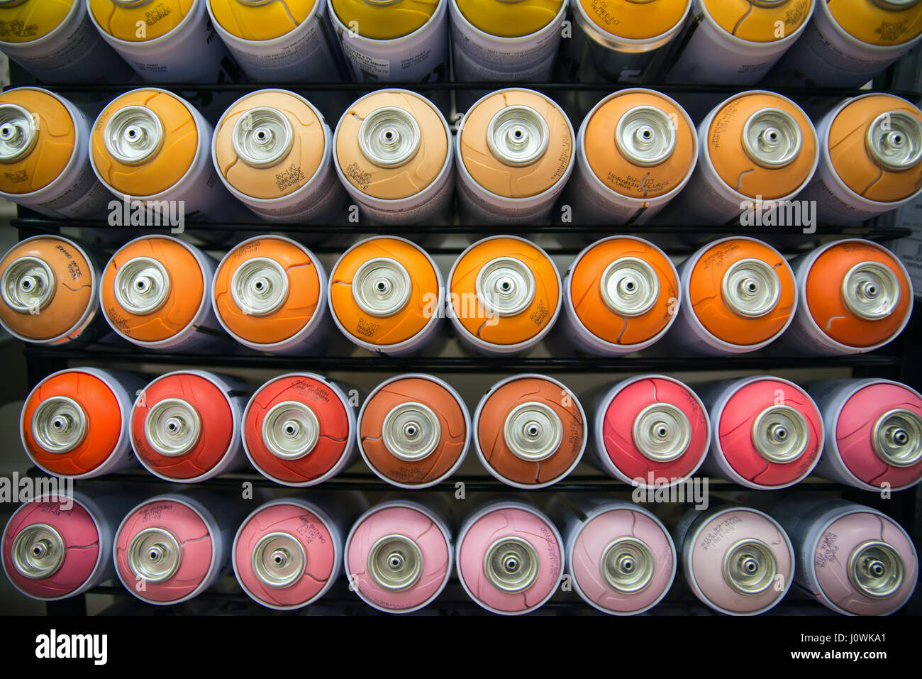 colorful cans of paint stand rows on a shelf Stock Photo - Alamy