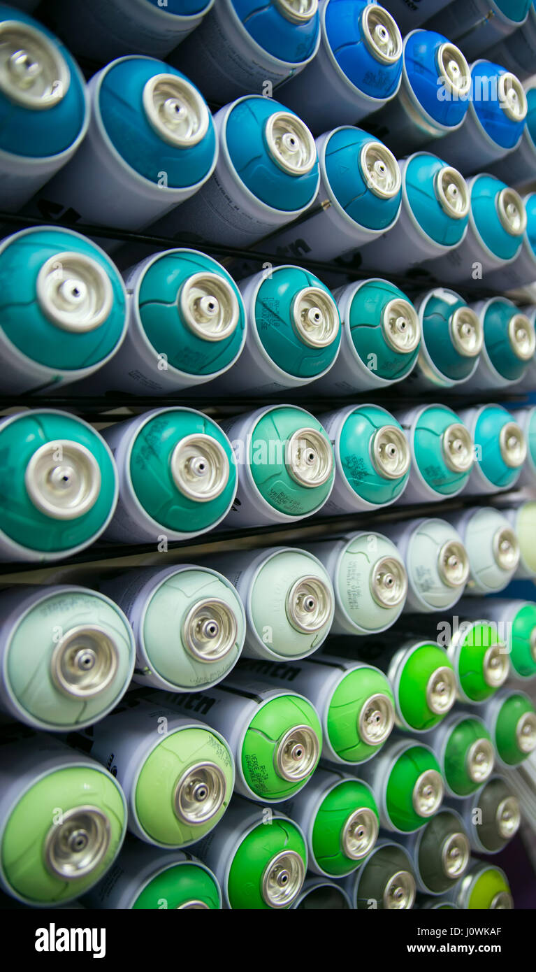 colorful cans of paint stand rows on a shelf Stock Photo - Alamy