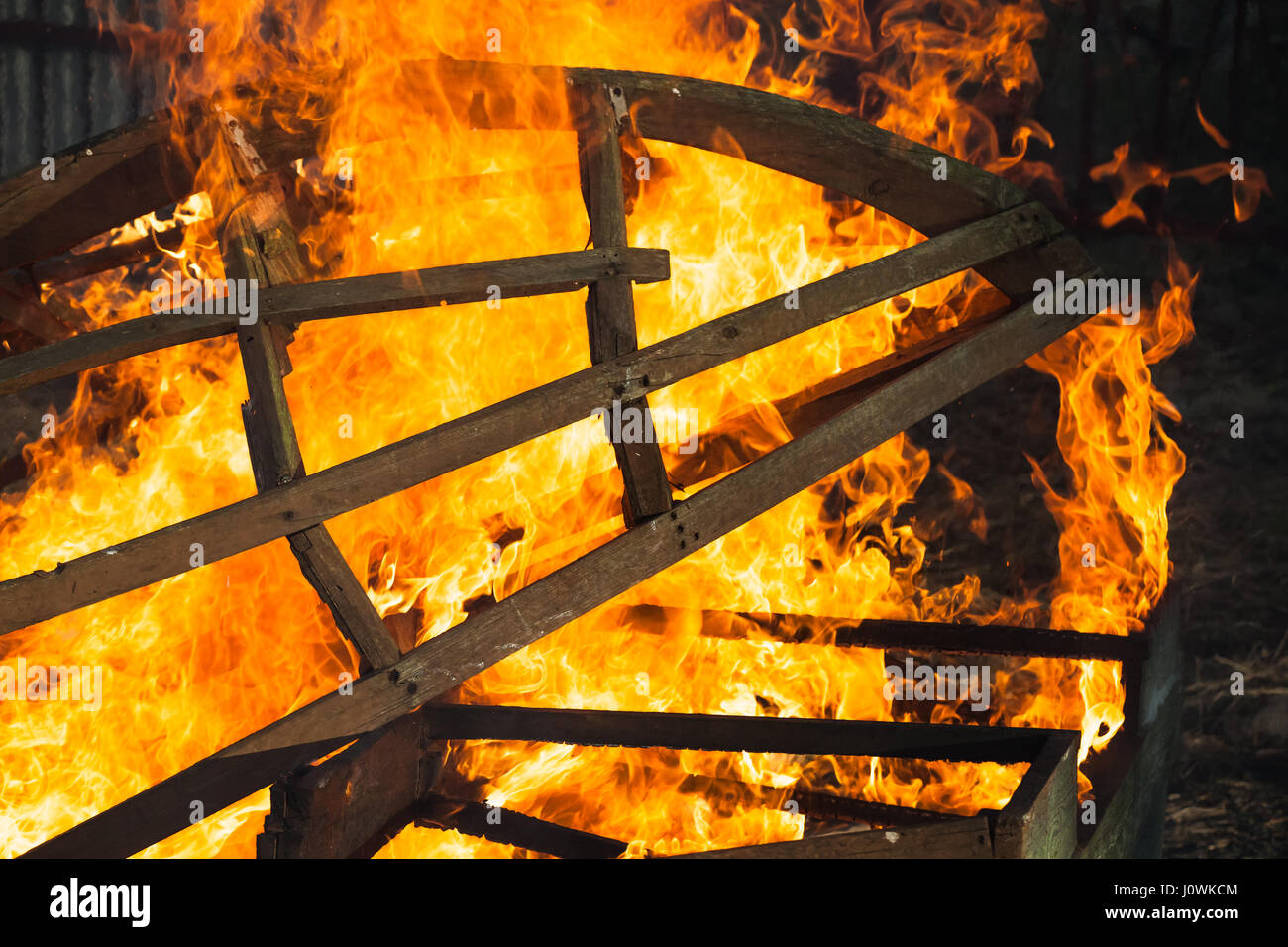 Burning wooden structure, outdoor bonfire background Stock Photo - Alamy