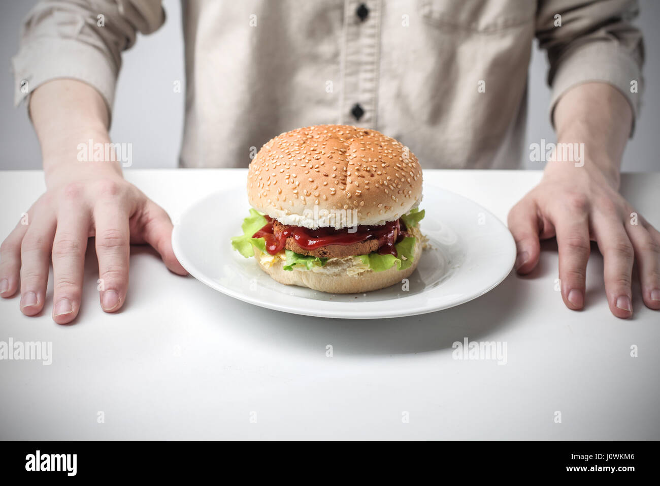 Hamburger on plate Stock Photo - Alamy