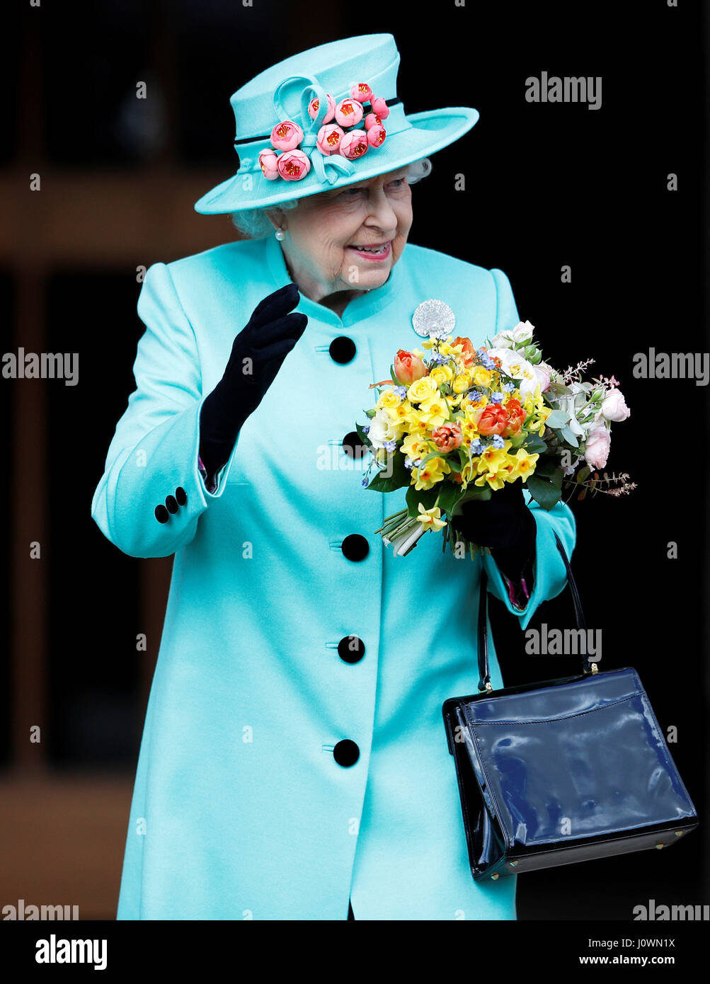 Queen Elizabeth II waves to onlookers as she leaves the Easter Sunday ...