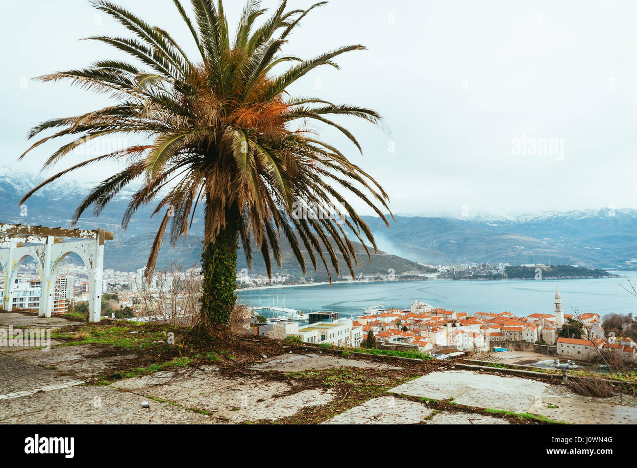 The Old Town of Budva, mountains covered with snow, Montenegro Stock ...