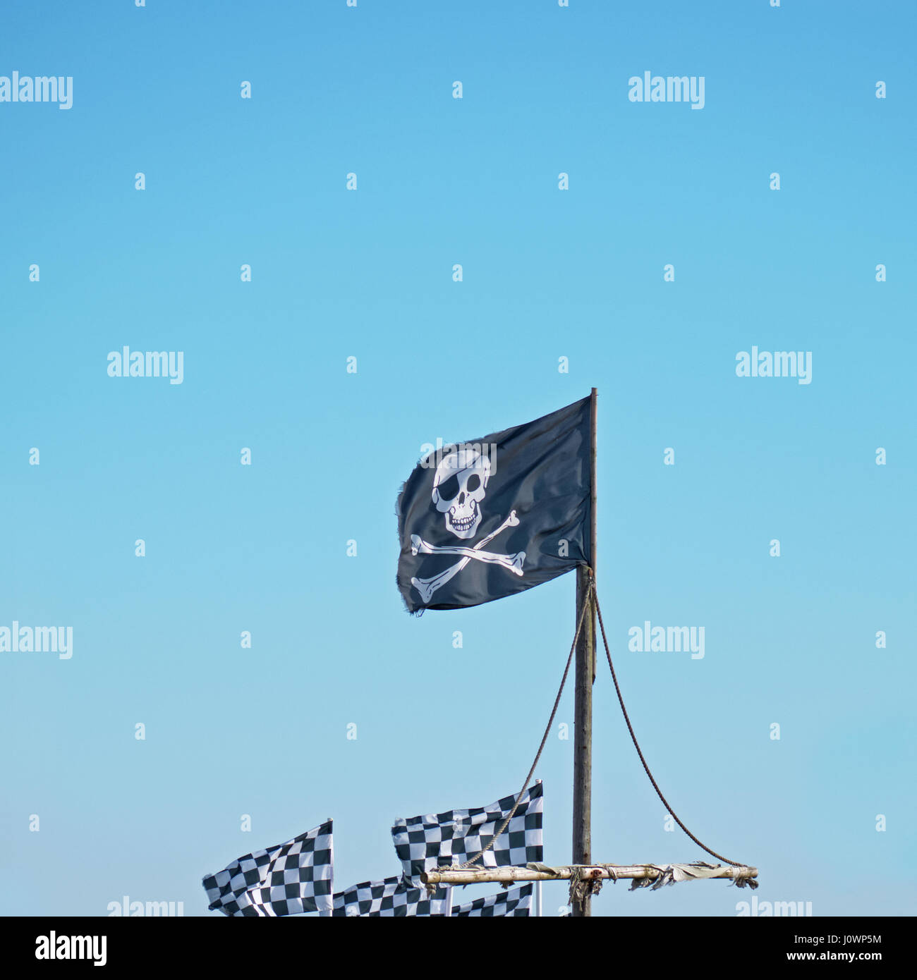 The skull and crossbones of the traditional pirate flag known as the ...