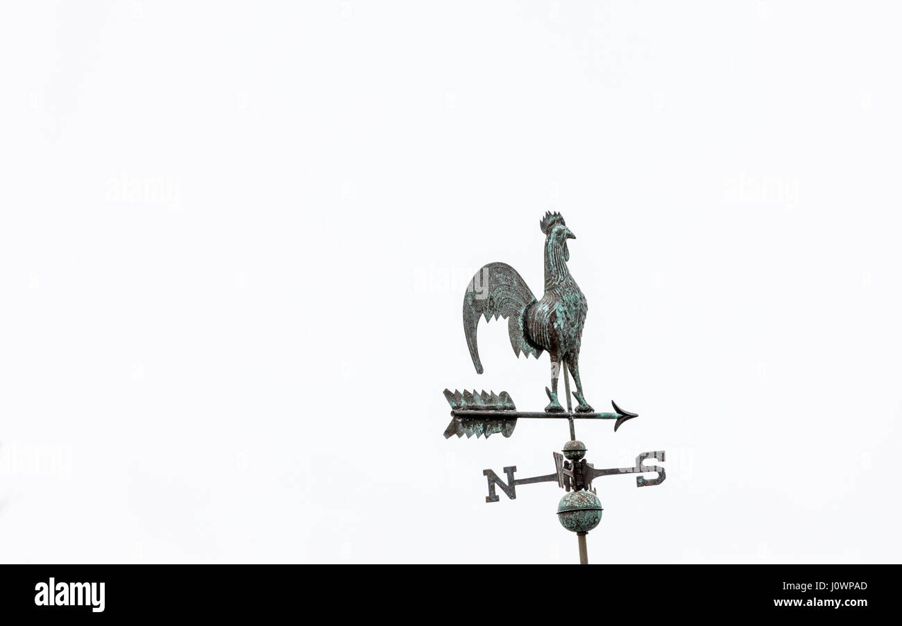 a metal rooster weather vane with arrow and letters of direction Stock ...