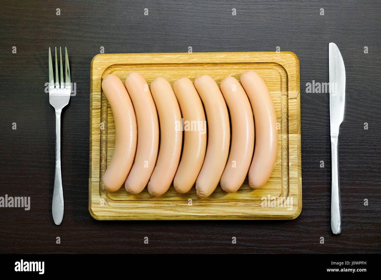 fresh sausages on white background Stock Photo - Alamy