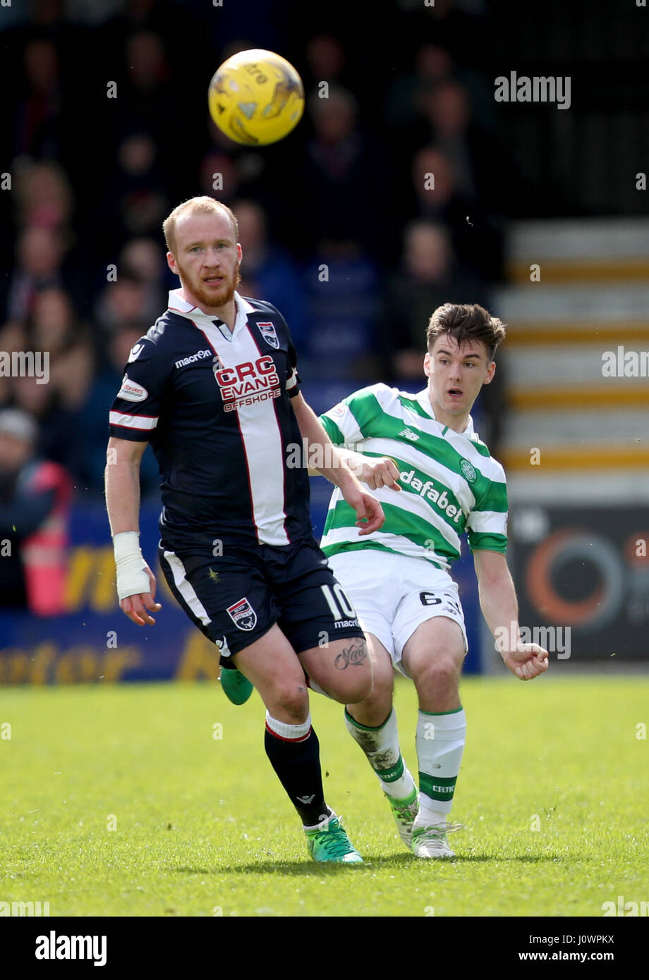 Ross County's Liam Boyce and Celtic's Kieran Tierney battle for the ...