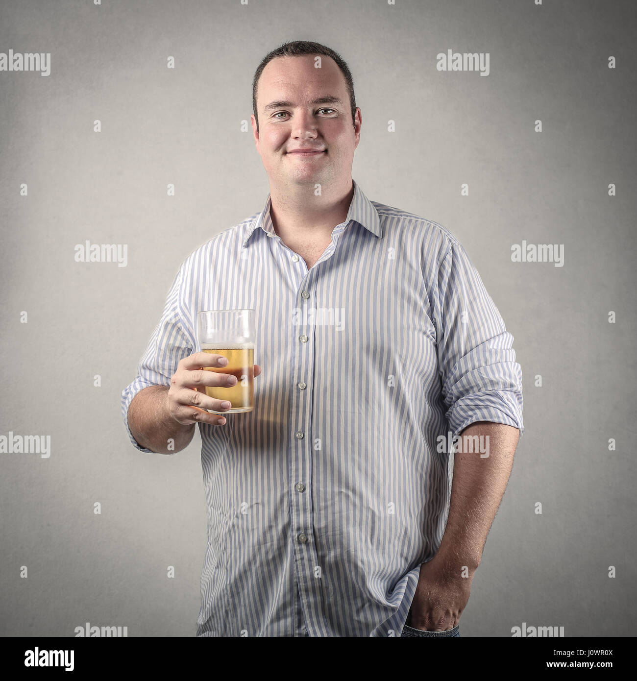 Fat man with beer Stock Photo - Alamy