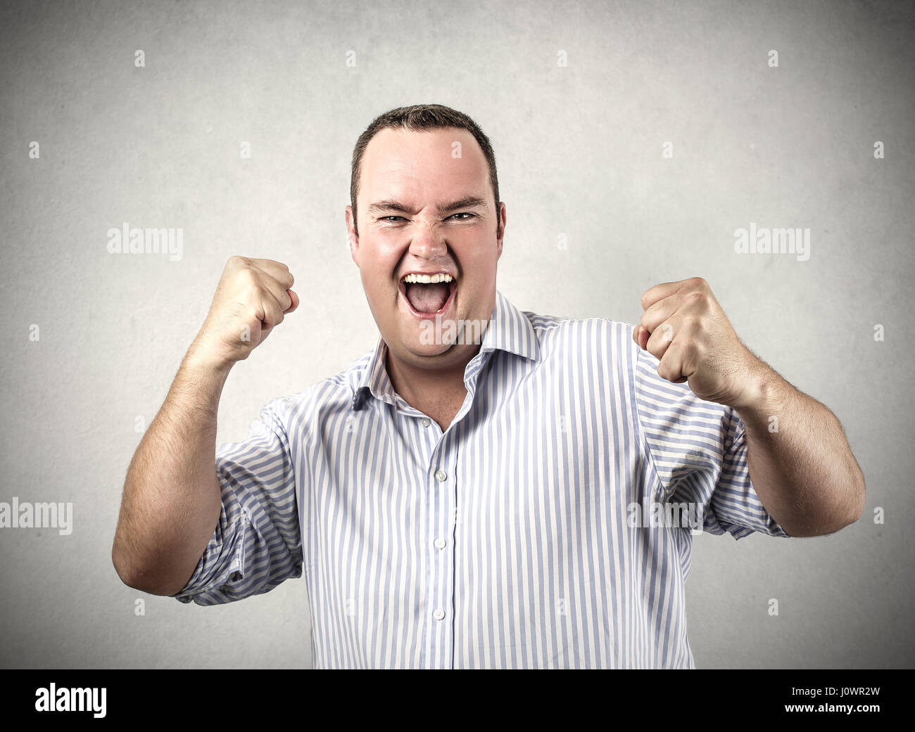 Fat man being happy and cheering inside Stock Photo - Alamy
