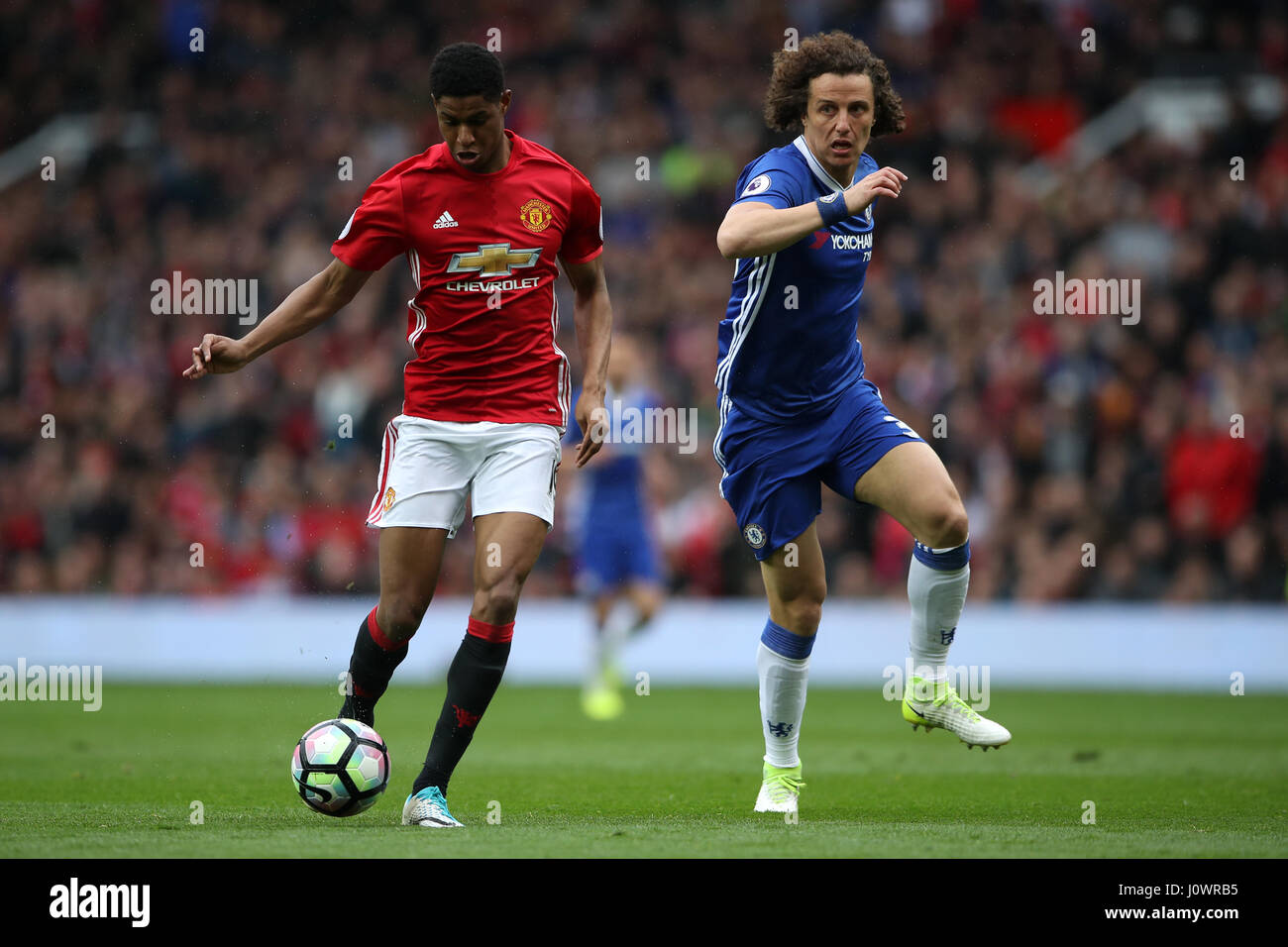 Manchester United's Marcus Rashford (left) scores his side's first goal ...