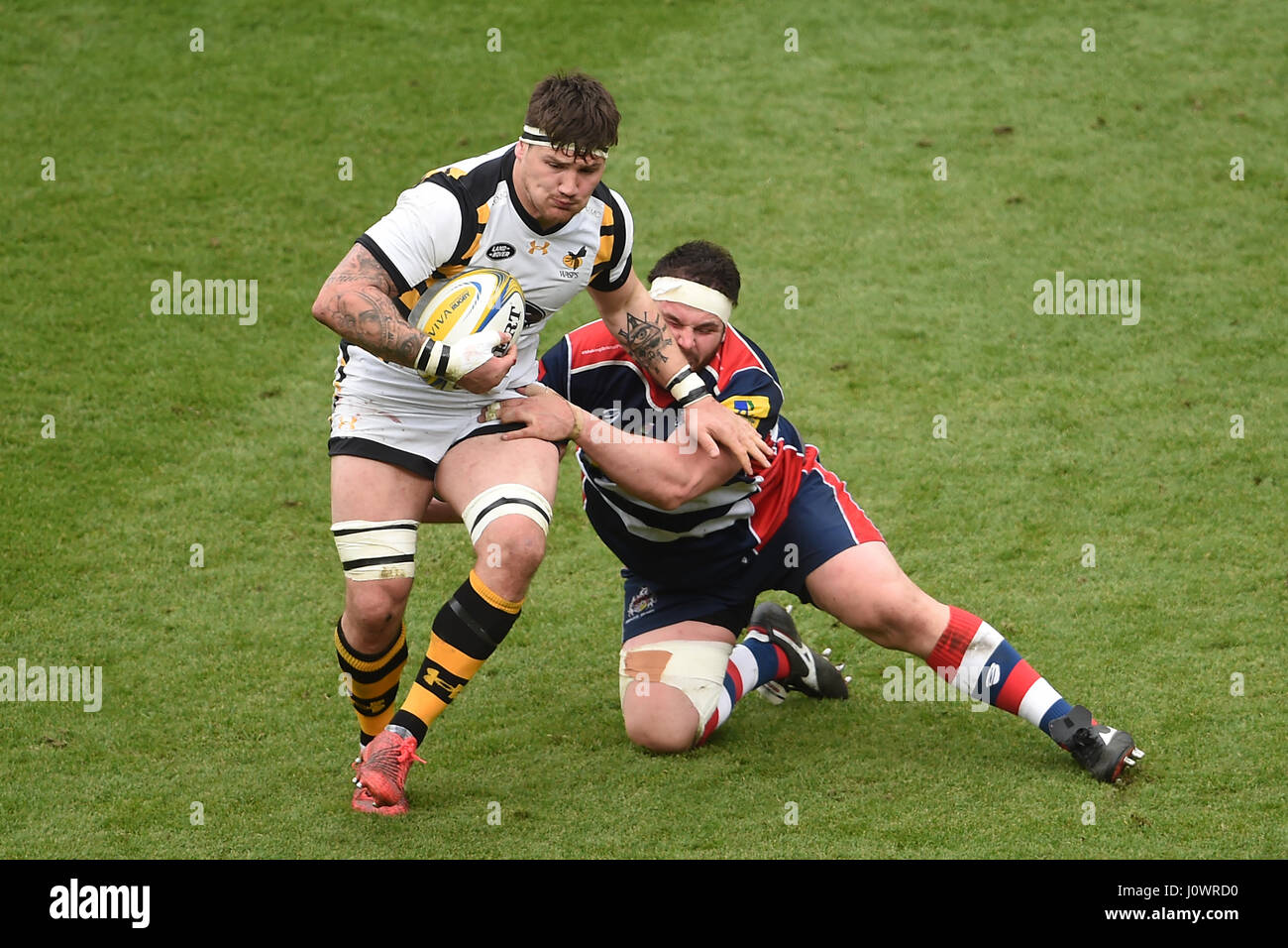 Wasps' Guy Thompson (left) is tackled by Bristol's Ryan Bevington ...