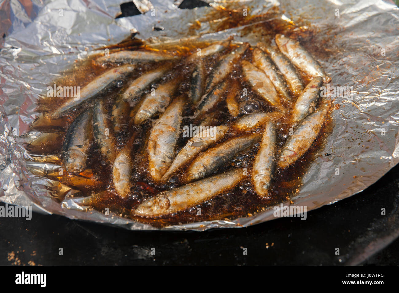 frying small fish in oil, close up Stock Photo - Alamy