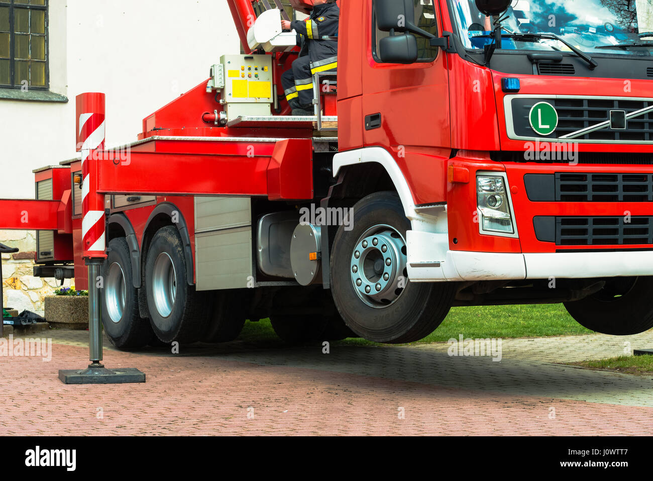 Fire ladder car during an action Stock Photo - Alamy