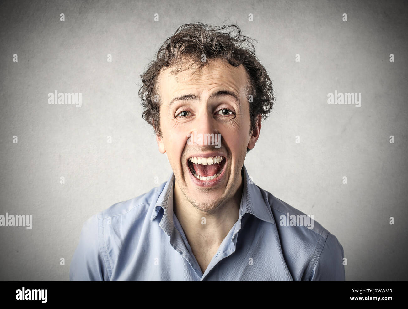 Man smiling inside Stock Photo - Alamy