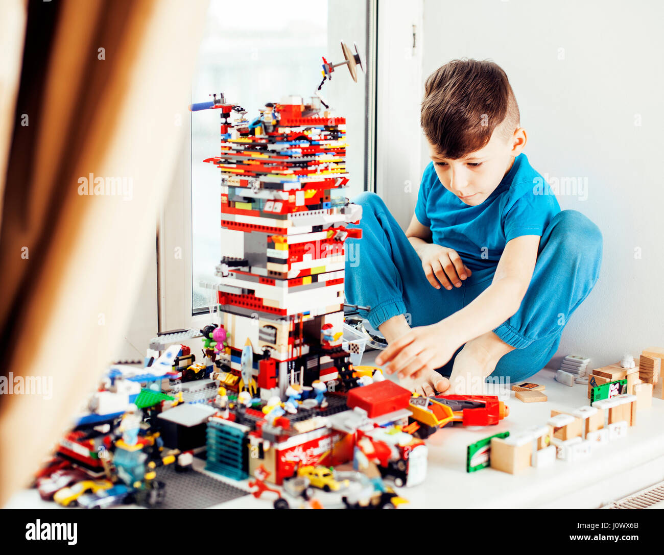 little cute preschooler boy playing lego toys at home happy smiling ...