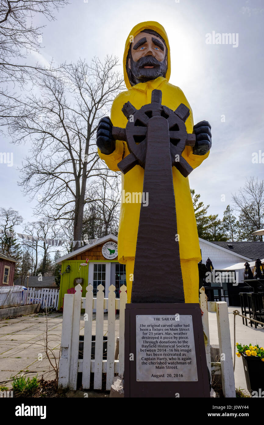 Captain Harry, a wood carving of a sailor, stands as the watchman of ...