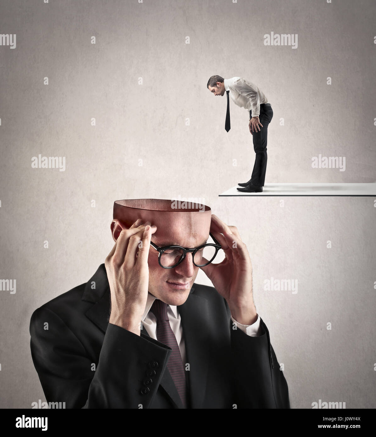 Businessman looking inside man's head Stock Photo - Alamy