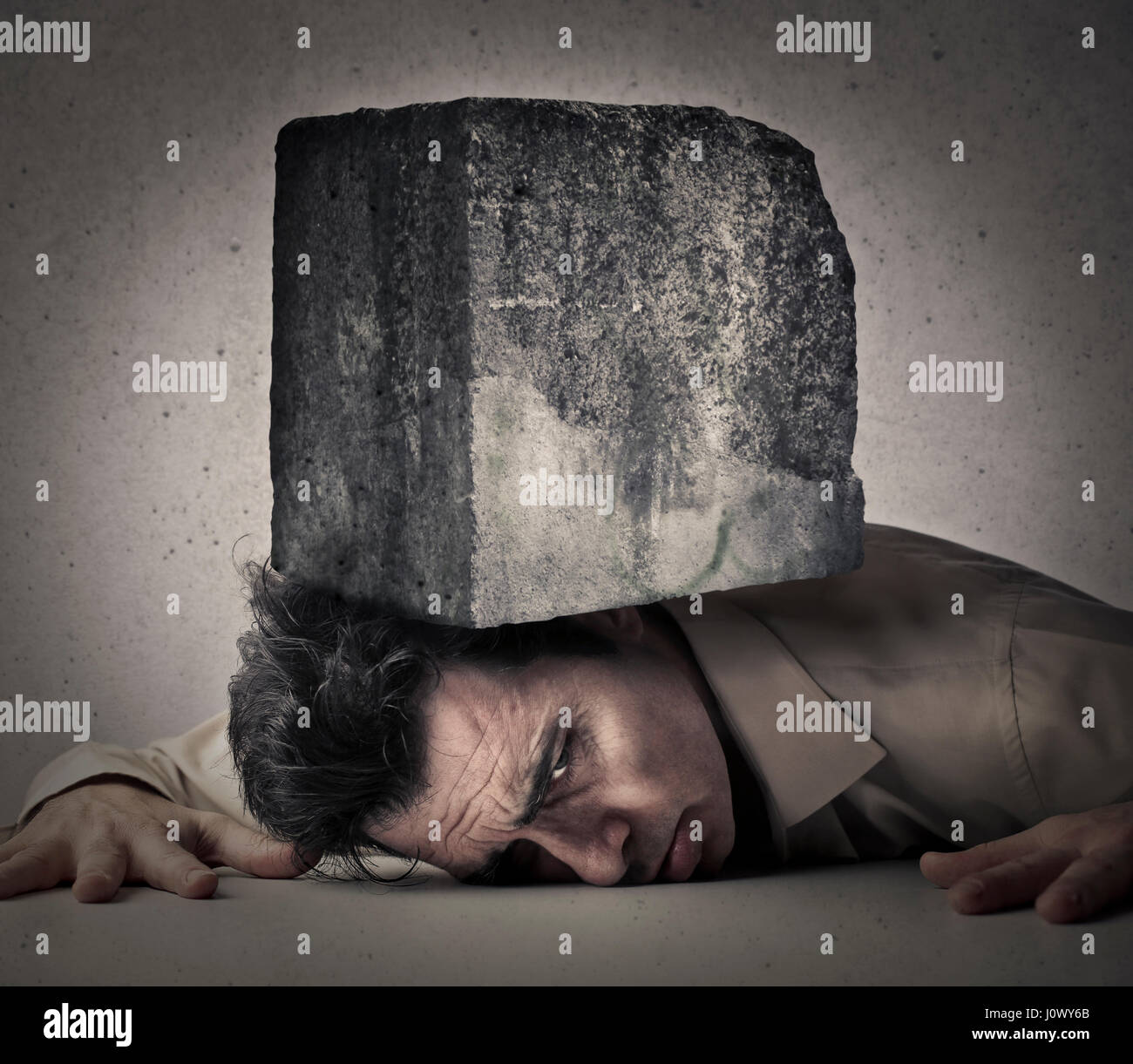 Man with rock on his head Stock Photo - Alamy