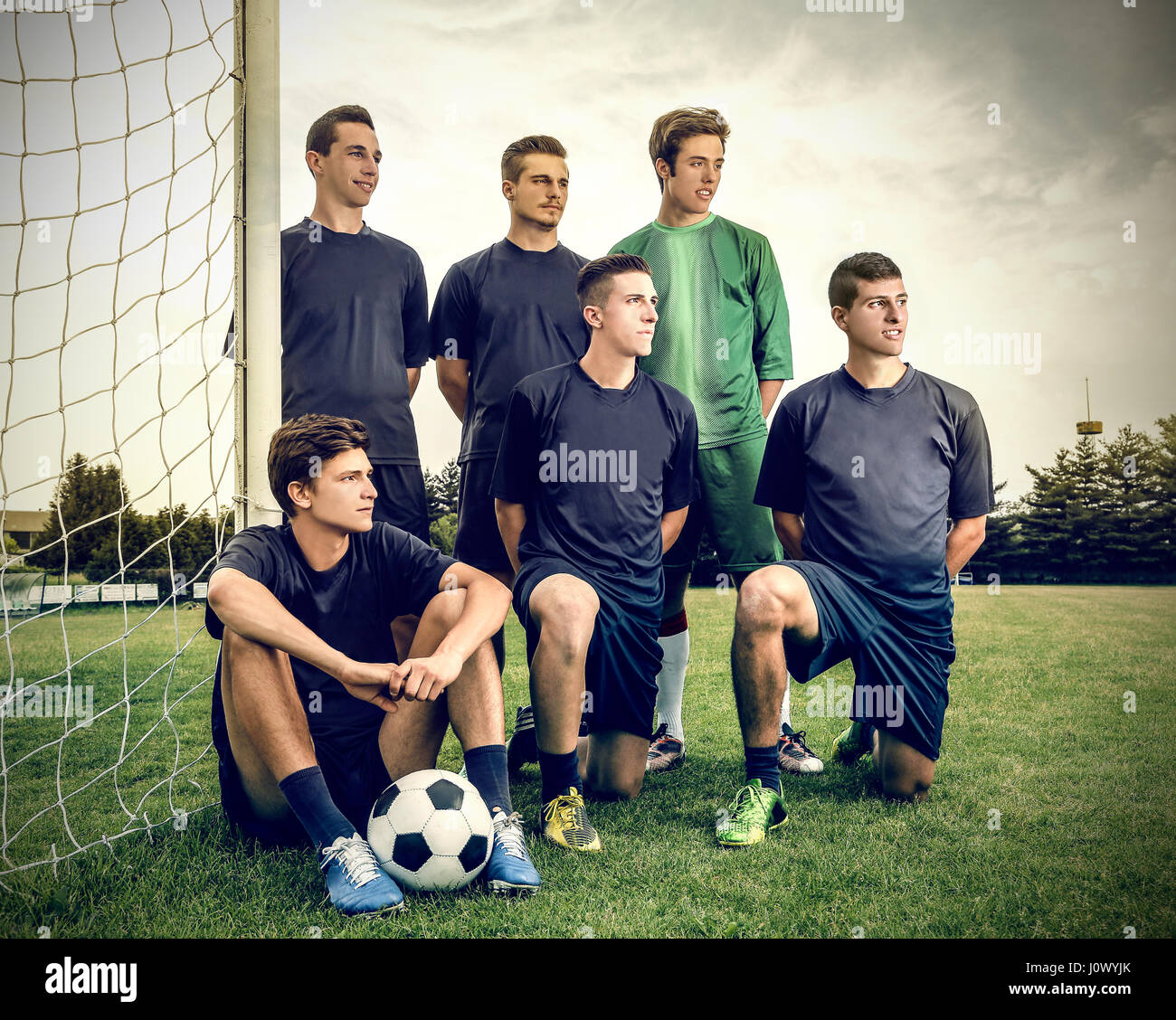 Football team posing for picture Stock Photo - Alamy