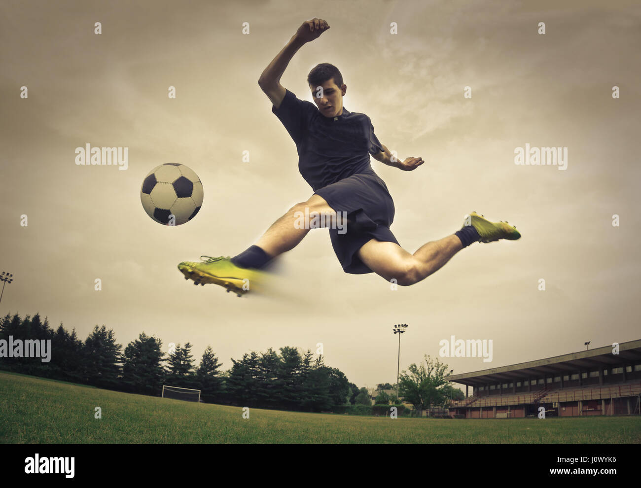Man playing football Stock Photo - Alamy