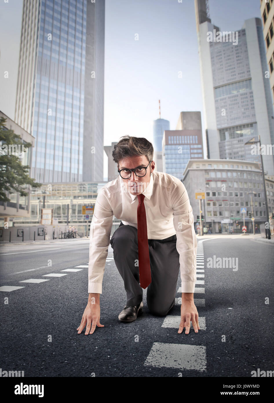Businessman at start lane Stock Photo - Alamy