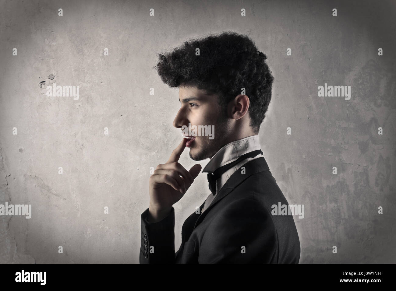 Businessman from profile thinking Stock Photo - Alamy