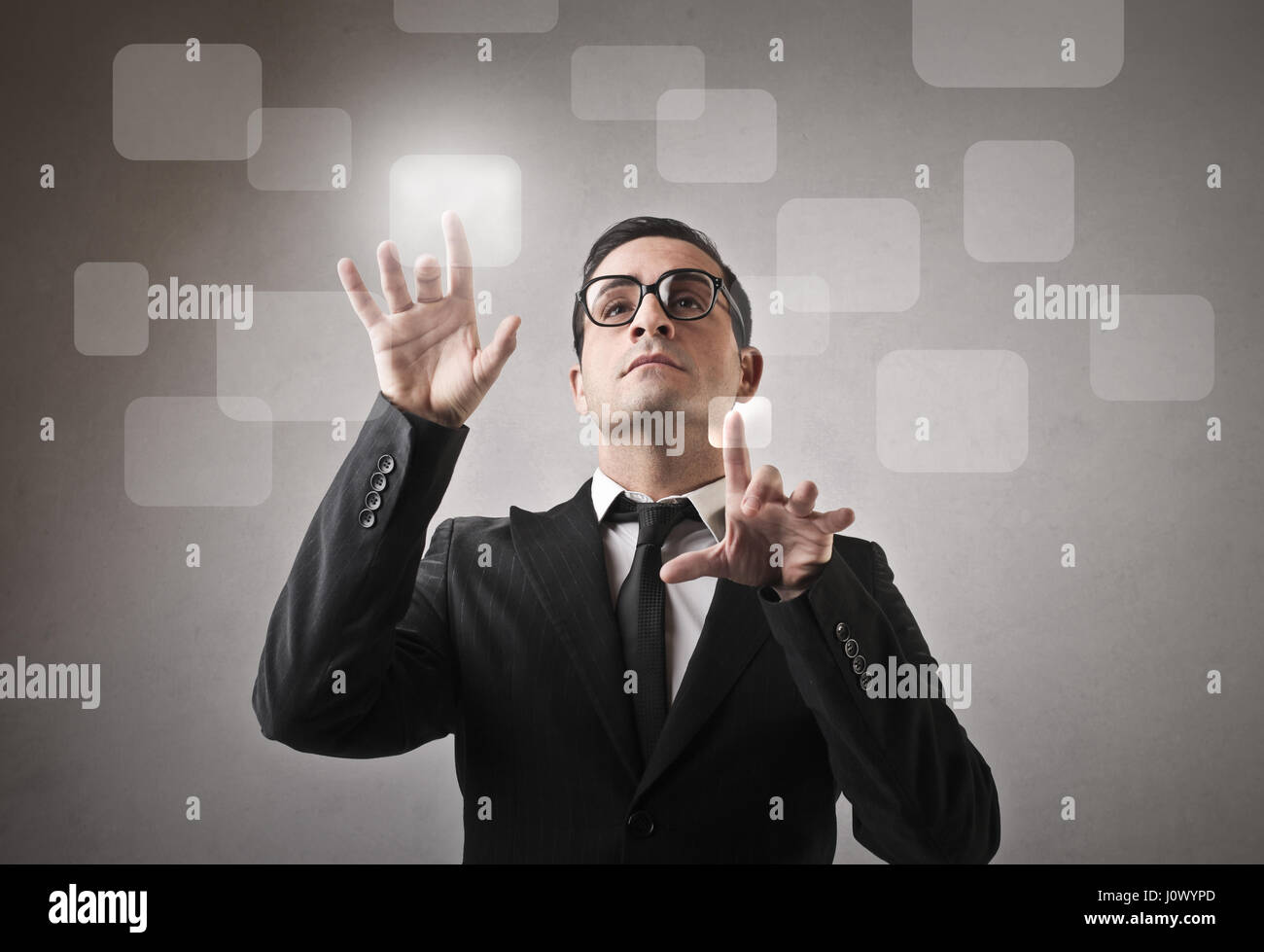 Businessman using touch screen Stock Photo - Alamy