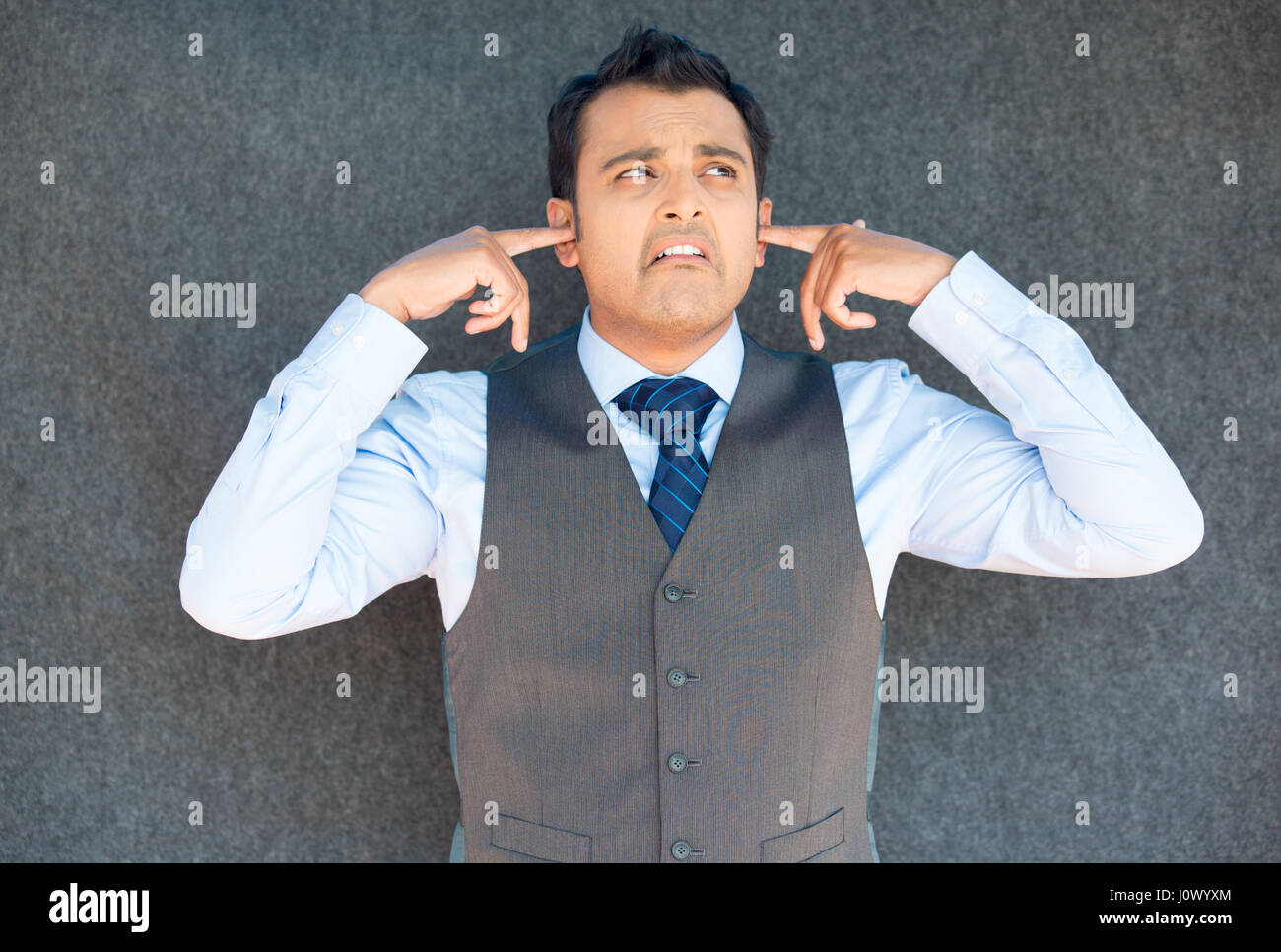 Closeup portrait, angry unhappy stressed man in vest and tie, covering ...