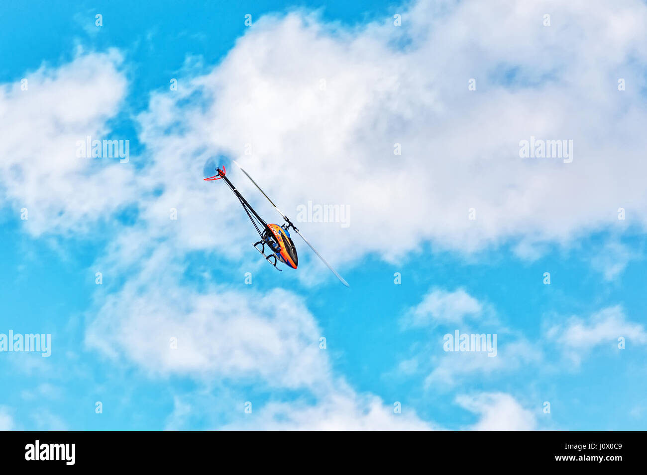 The flight of a radio-controlled 3D helicopter Stock Photo - Alamy