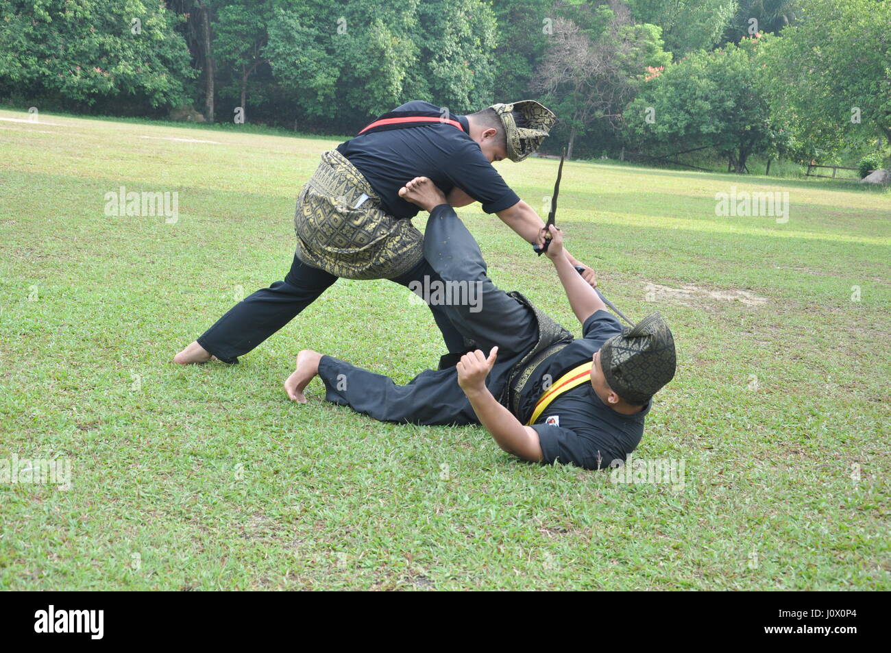 scene fighting students of one Malay martial art in Malaysia. Show how ...