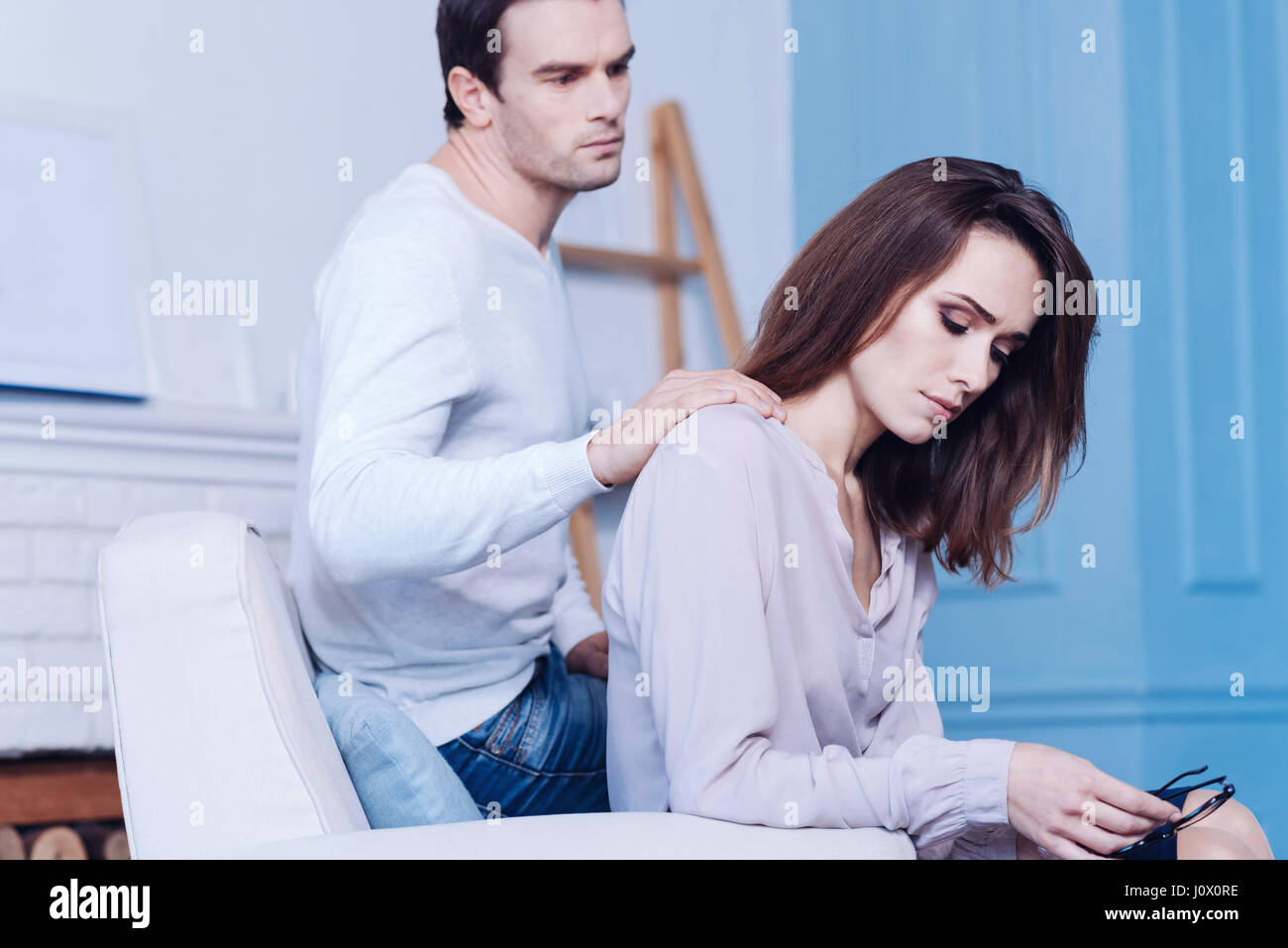 Handsome caring man supporting his girlfriend Stock Photo - Alamy
