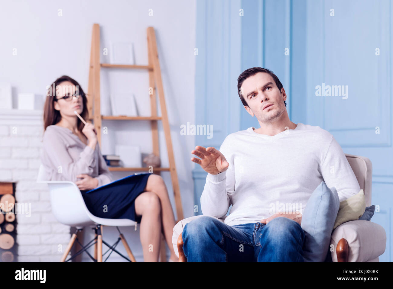 Handsome unhappy man telling about his problems Stock Photo - Alamy