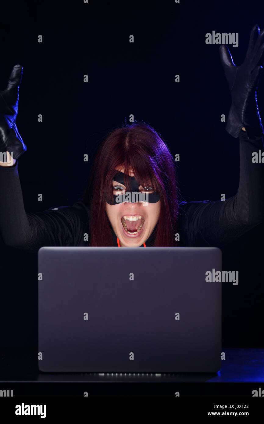 Photo of thief with computer Stock Photo - Alamy