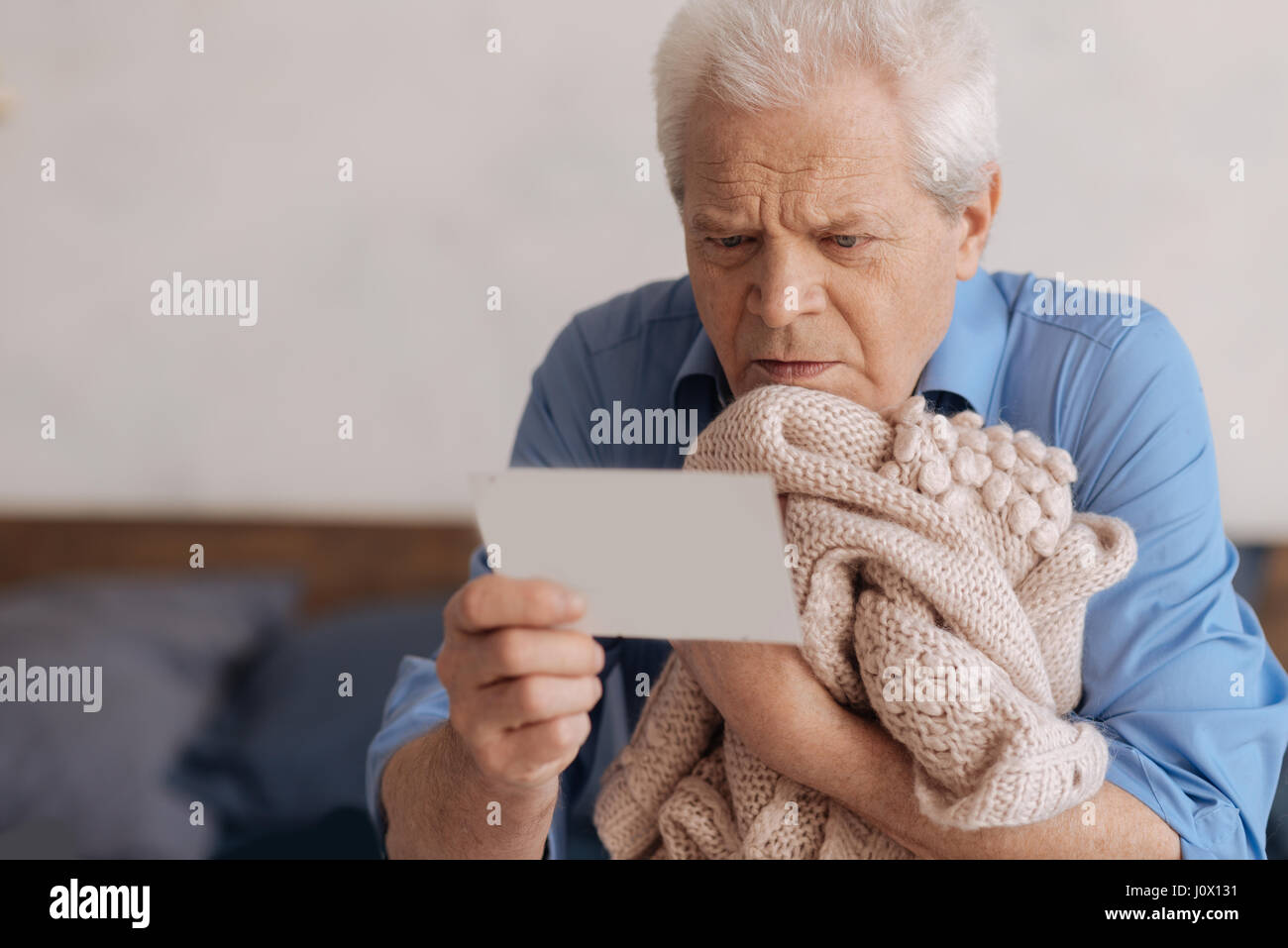 Sad unhappy man reading a note Stock Photo - Alamy