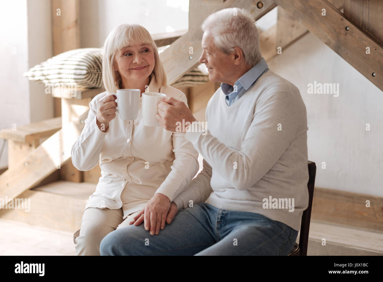 Happy aged couple drinking tea Stock Photo - Alamy