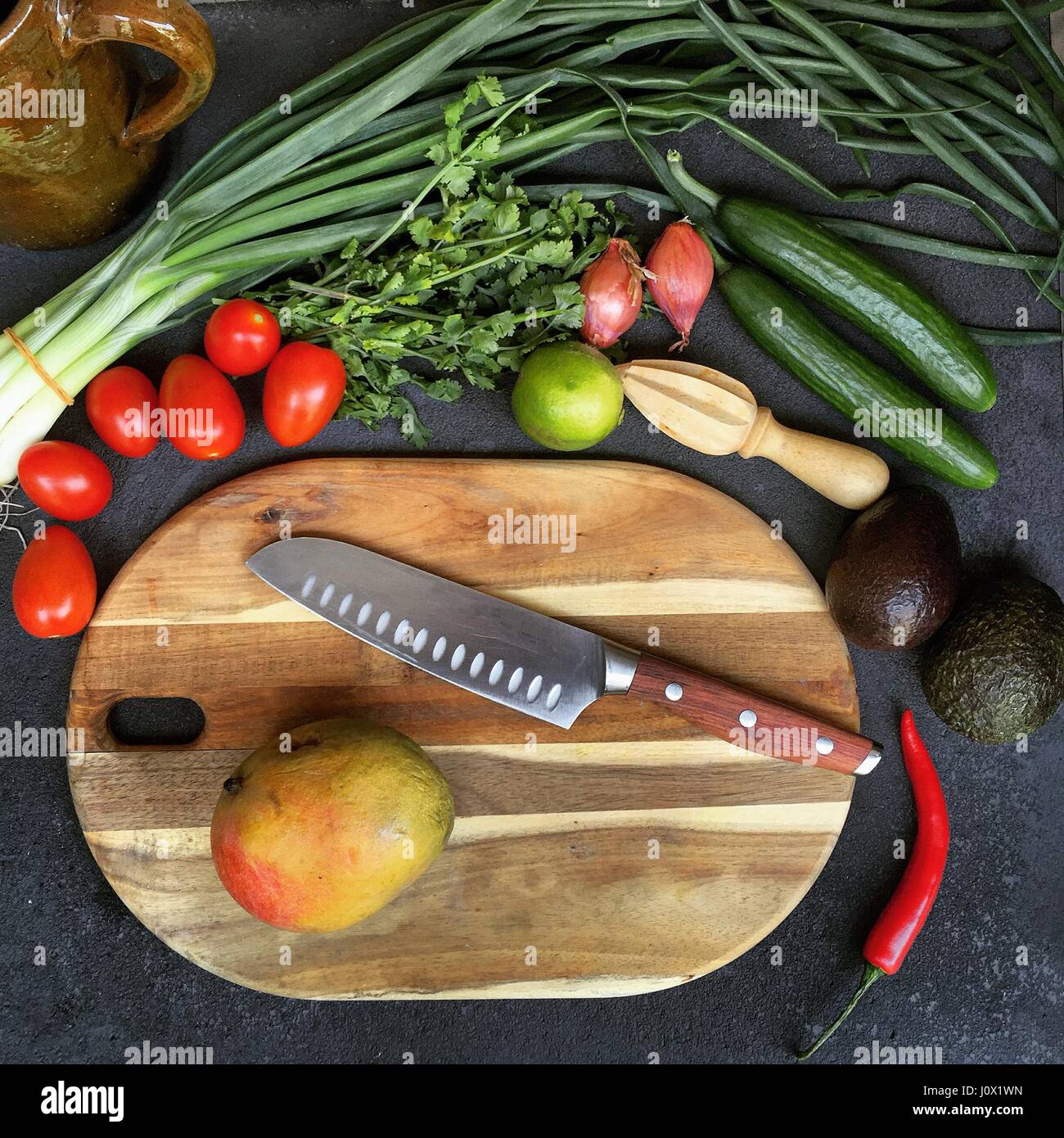 Mango fruit on chopping board hi-res stock photography and images - Alamy