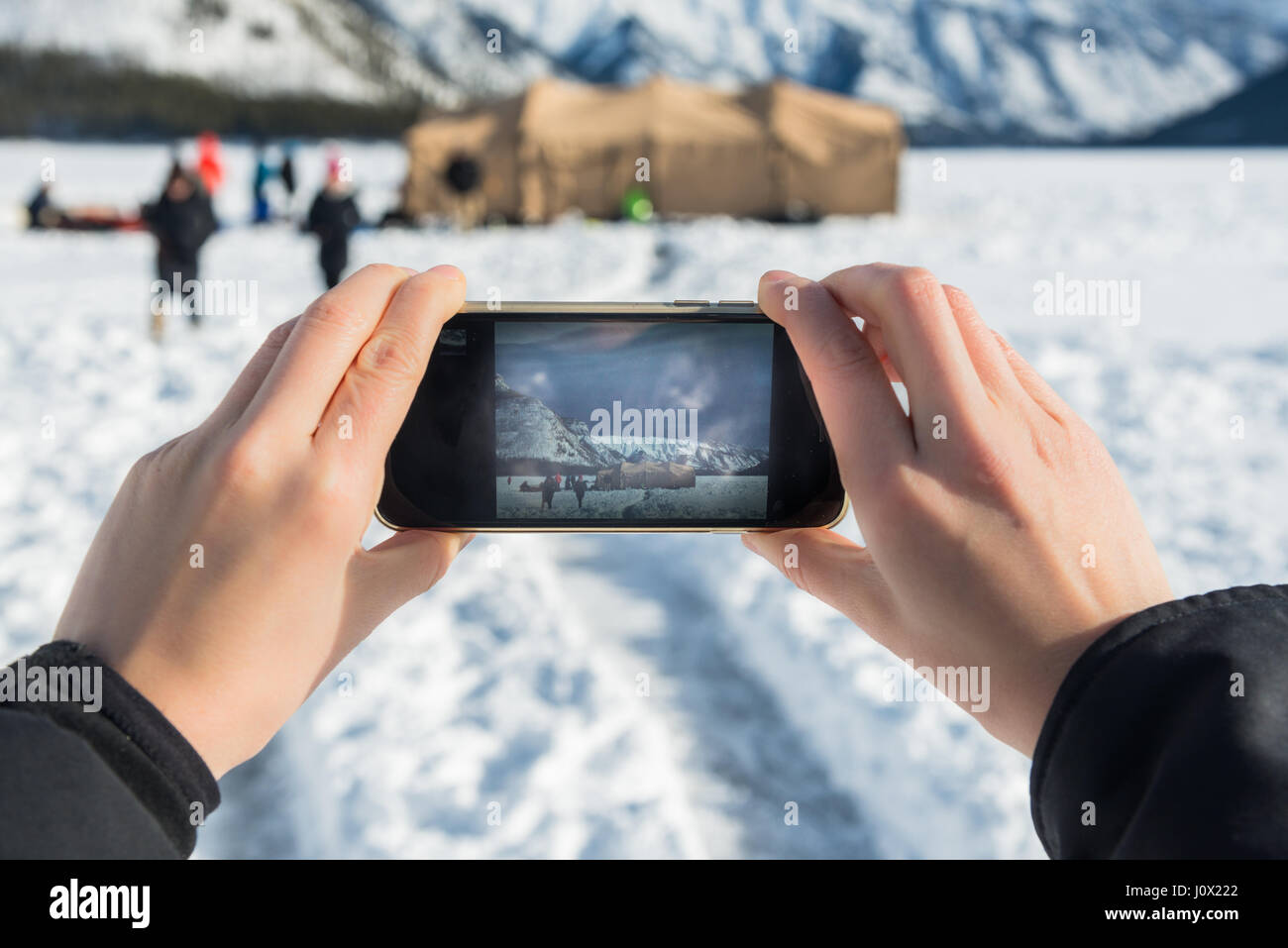 Man photographing people ice diving, Banff, Alberta, Canada Stock Photo ...