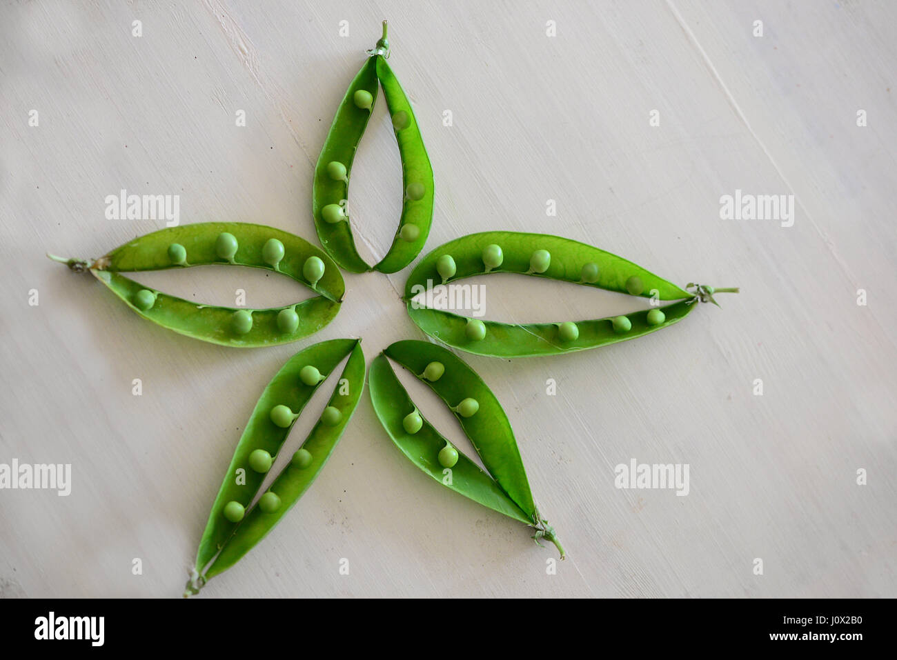 Pea pods arranged in a star shape Stock Photo - Alamy