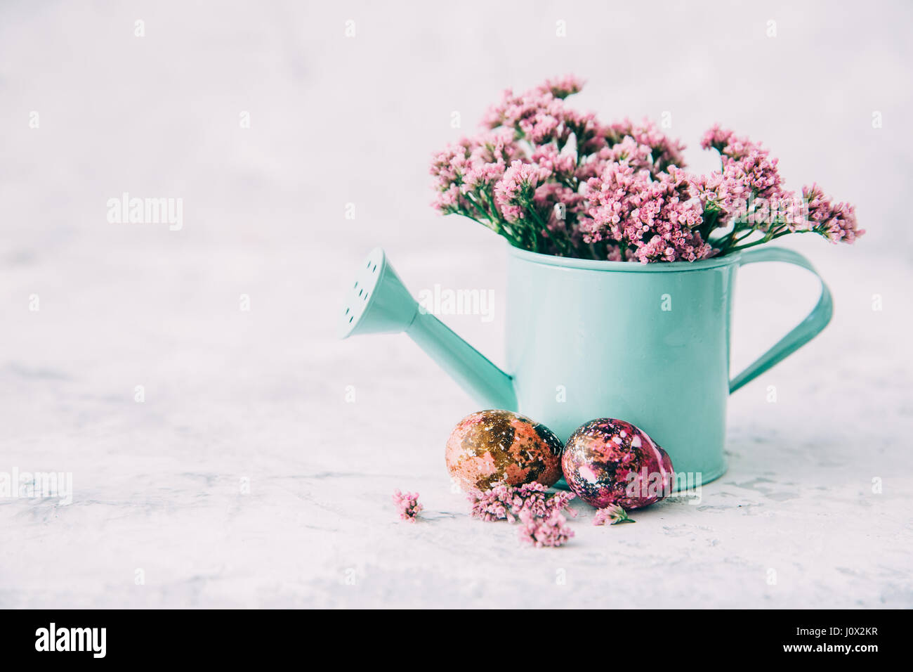 watering can with flowers Stock Photo - Alamy