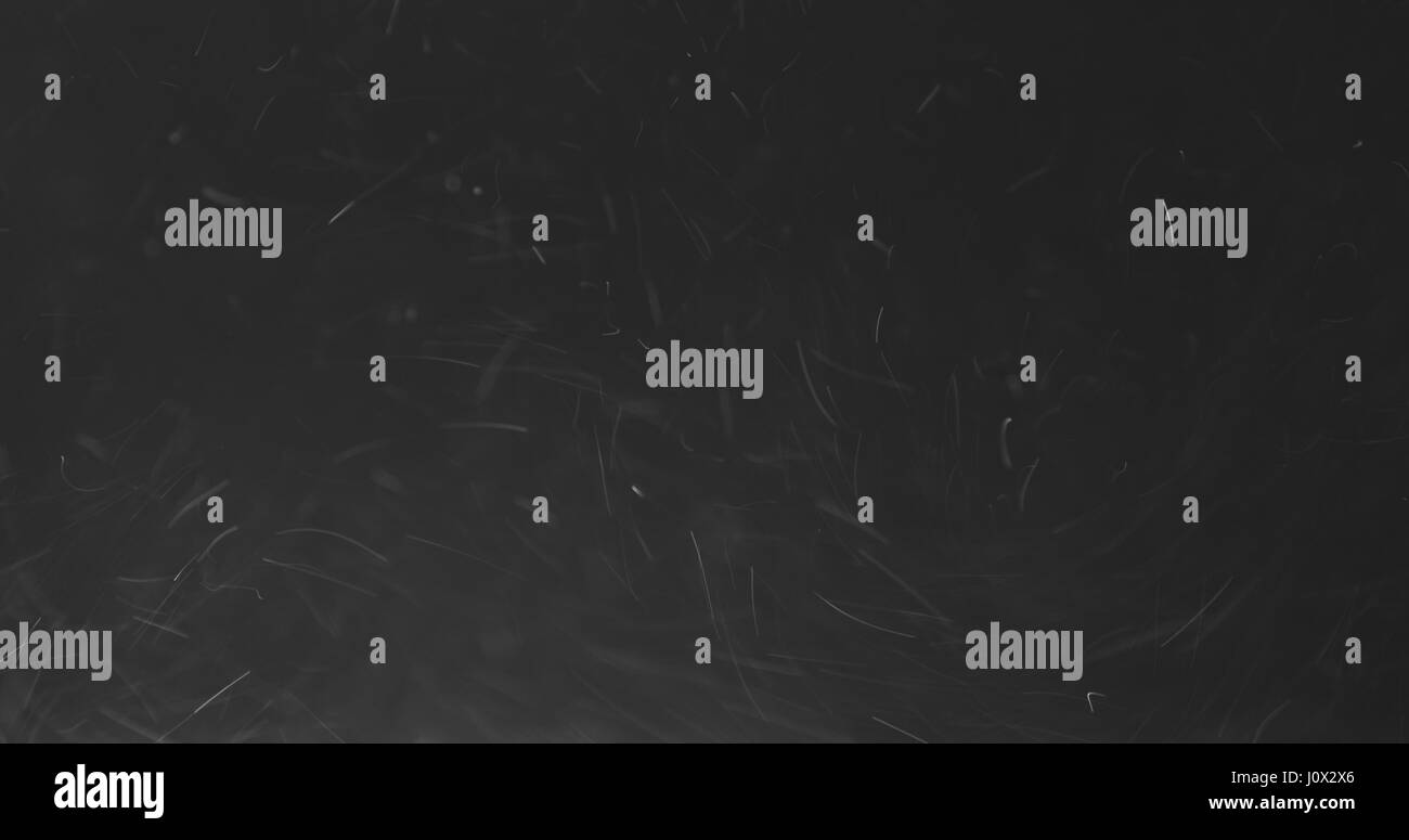dust particles fast moving over black background from left Stock Photo ...