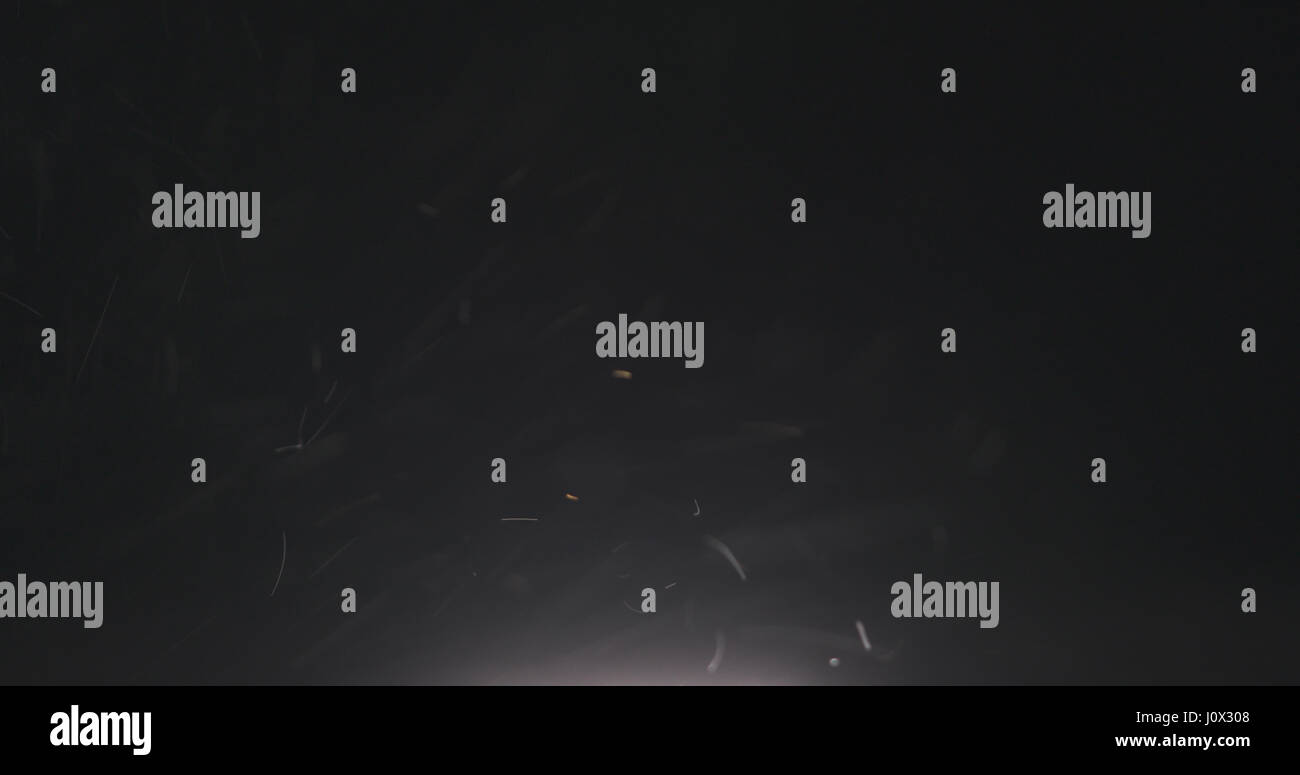 dust particles fast moving over black background from below Stock Photo ...