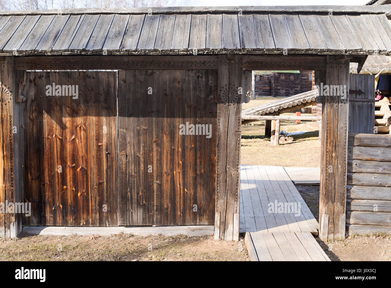 Wooden rural gate near the old house on a spring day Stock Photo - Alamy