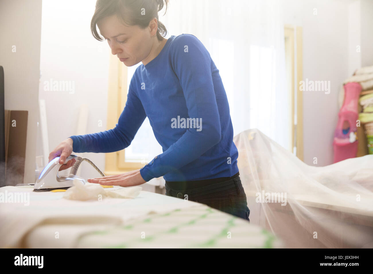 Young woman tailoring in her own small business crafting atelier Stock ...