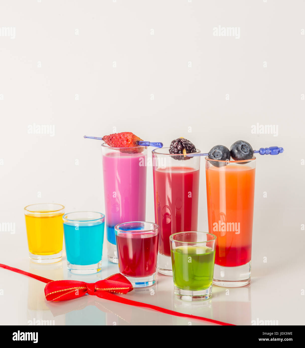 Colorful set of drinks, color drink decorated with fruit, color shots ...