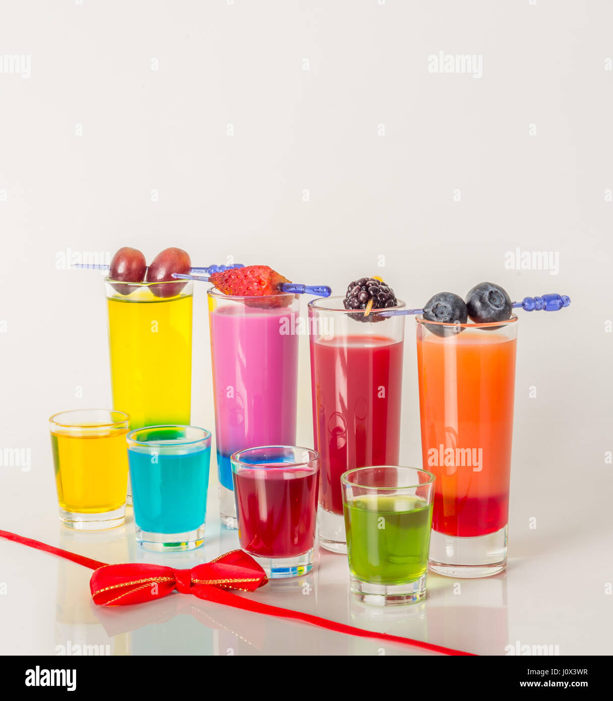 Colorful set of drinks, color drink decorated with fruit, color shots ...