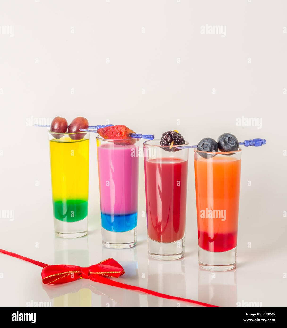 Colorful set of drinks, color drink decorated with fruit, color shots ...